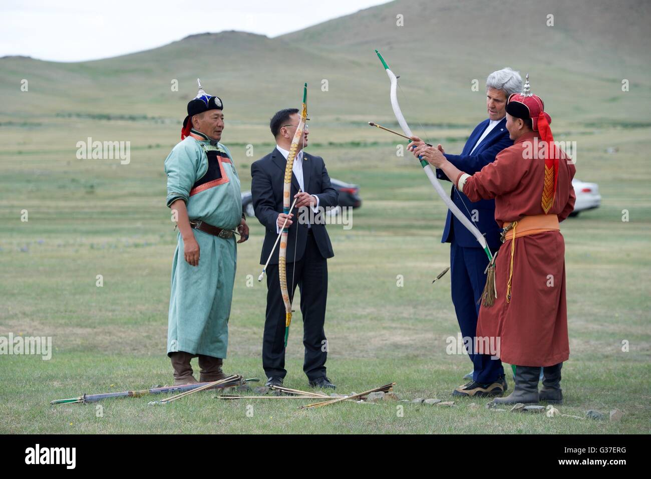 U.S Secretary of State John Kerry is shown how to shoot a Mongolian ...
