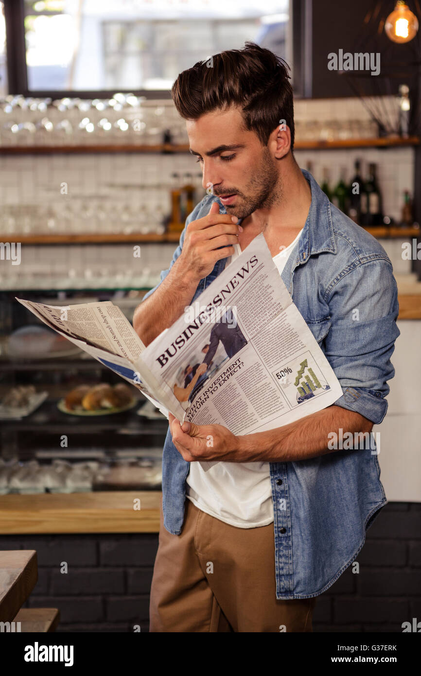 Man reading the newspaper Stock Photo - Alamy