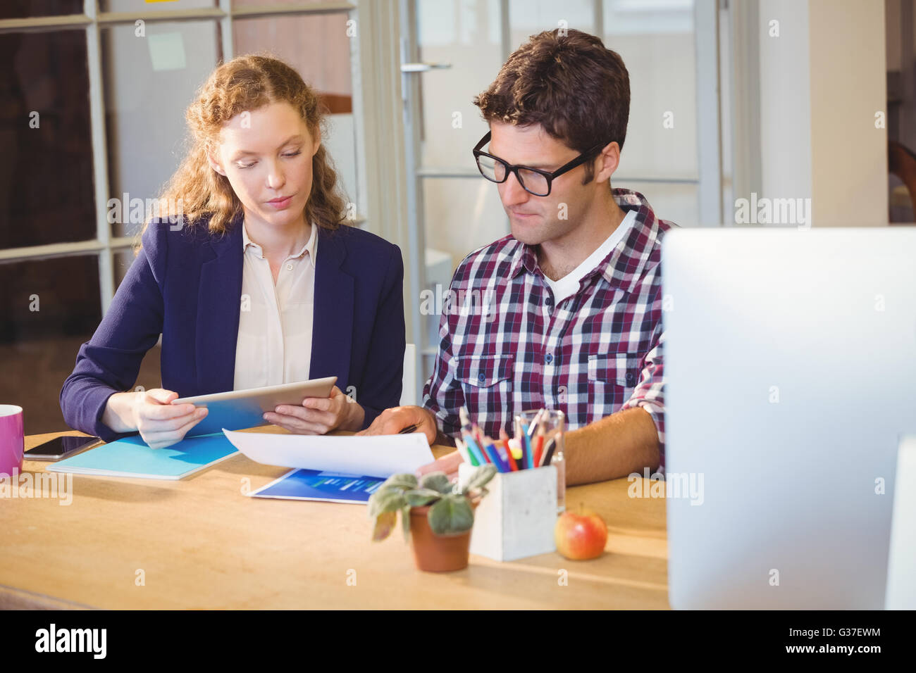 Two colleagues working together Stock Photo - Alamy