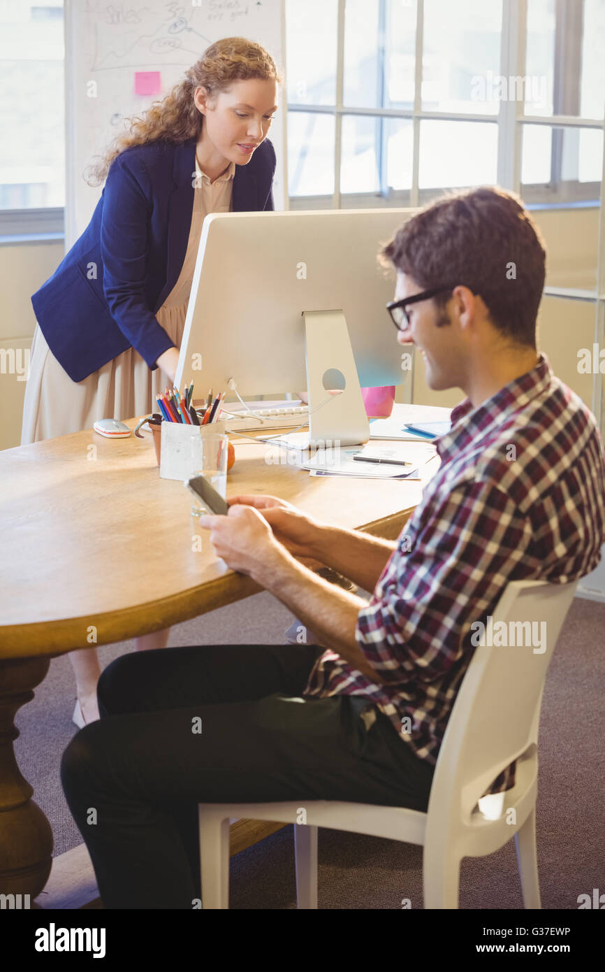 Two colleagues working in the same office Stock Photo - Alamy