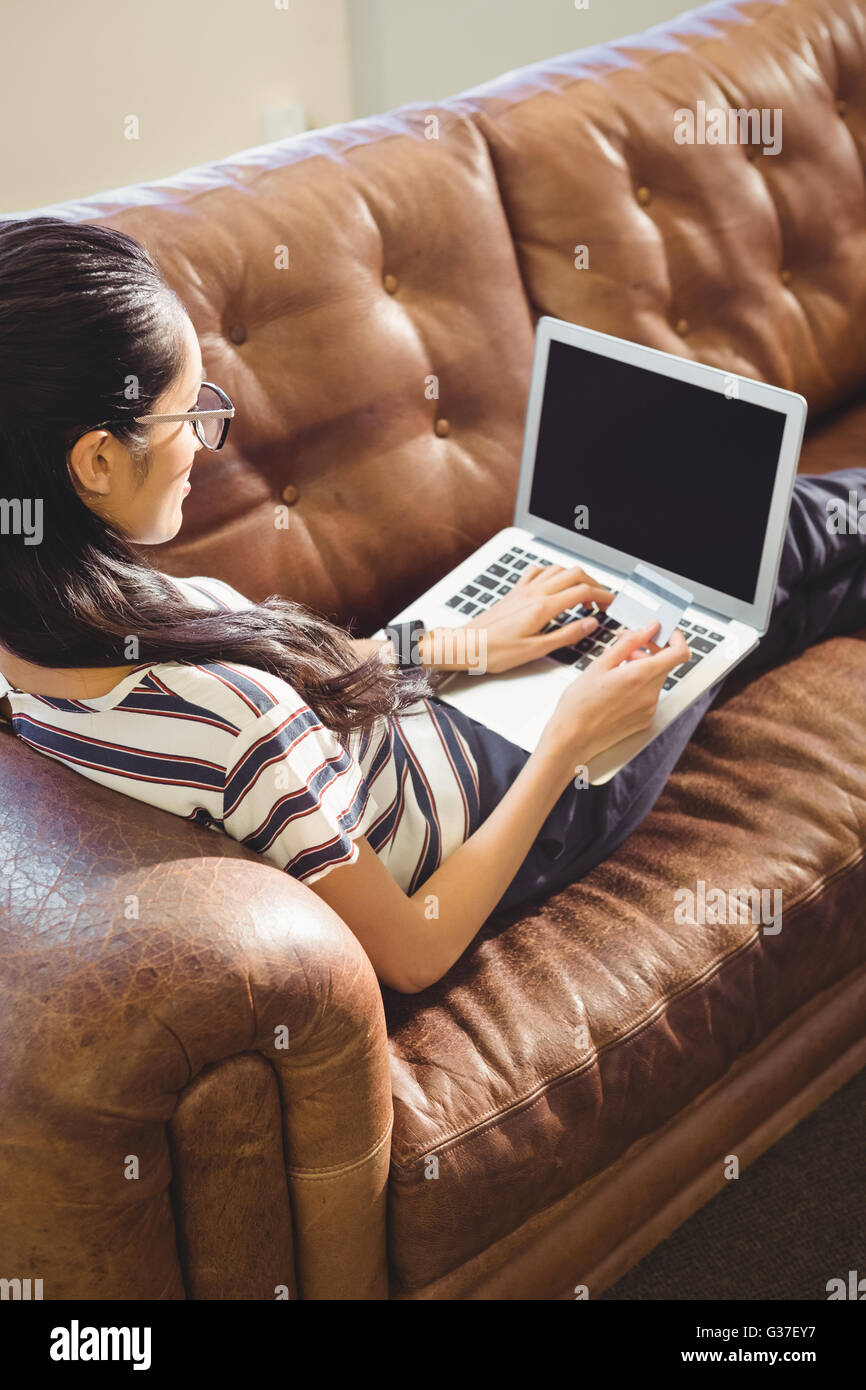Business woman posing in front of her computer with her card Stock ...