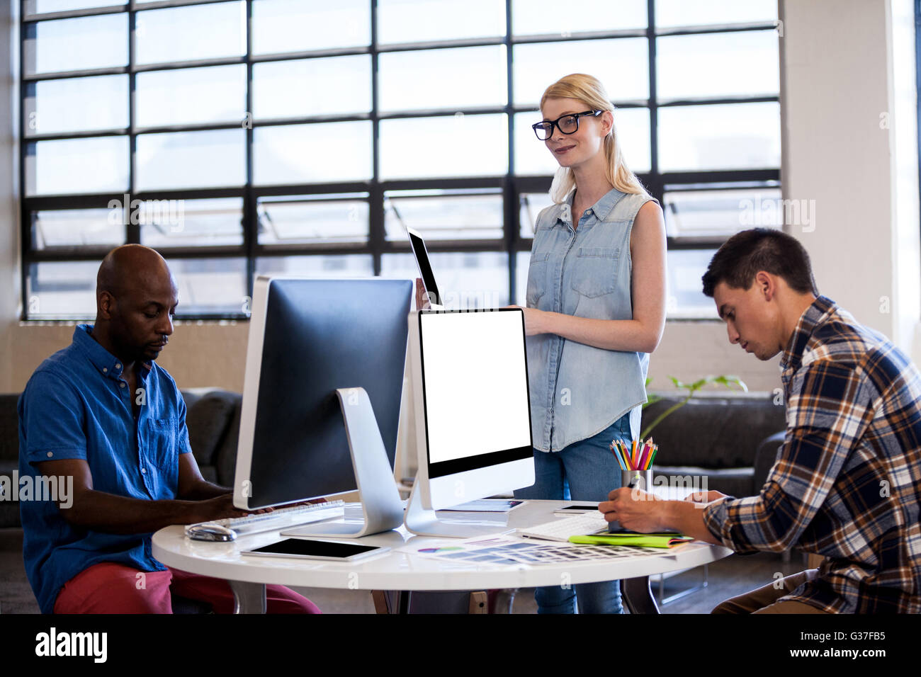 Business team working on computer Stock Photo - Alamy