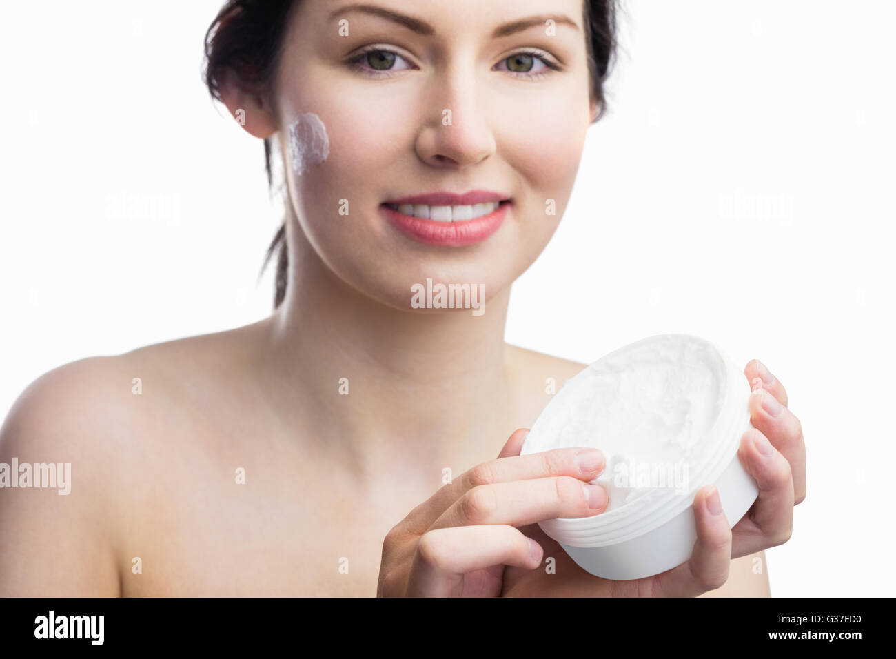 Woman applying a cream Stock Photo - Alamy