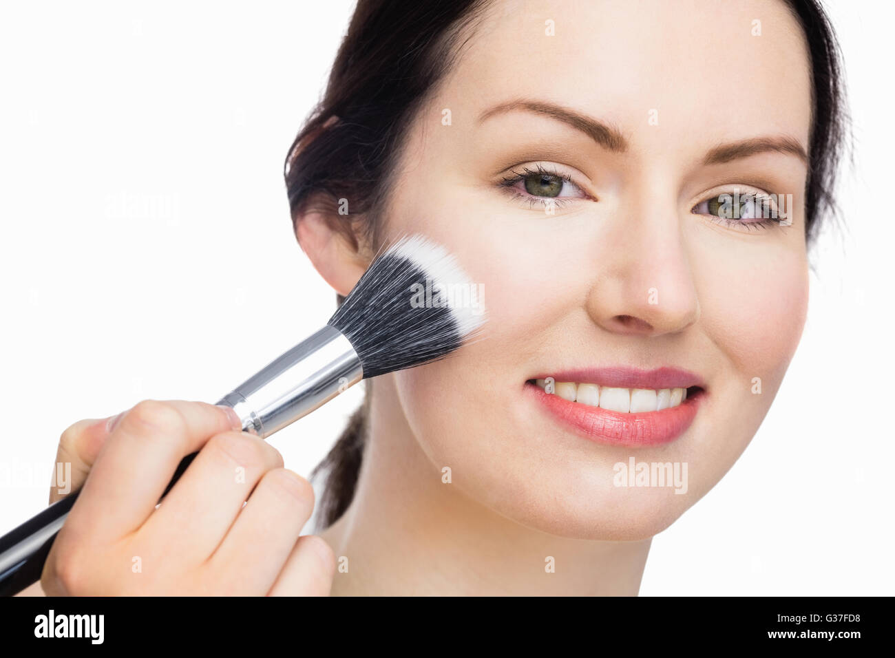 Gorgeous Woman applying makeup Stock Photo - Alamy