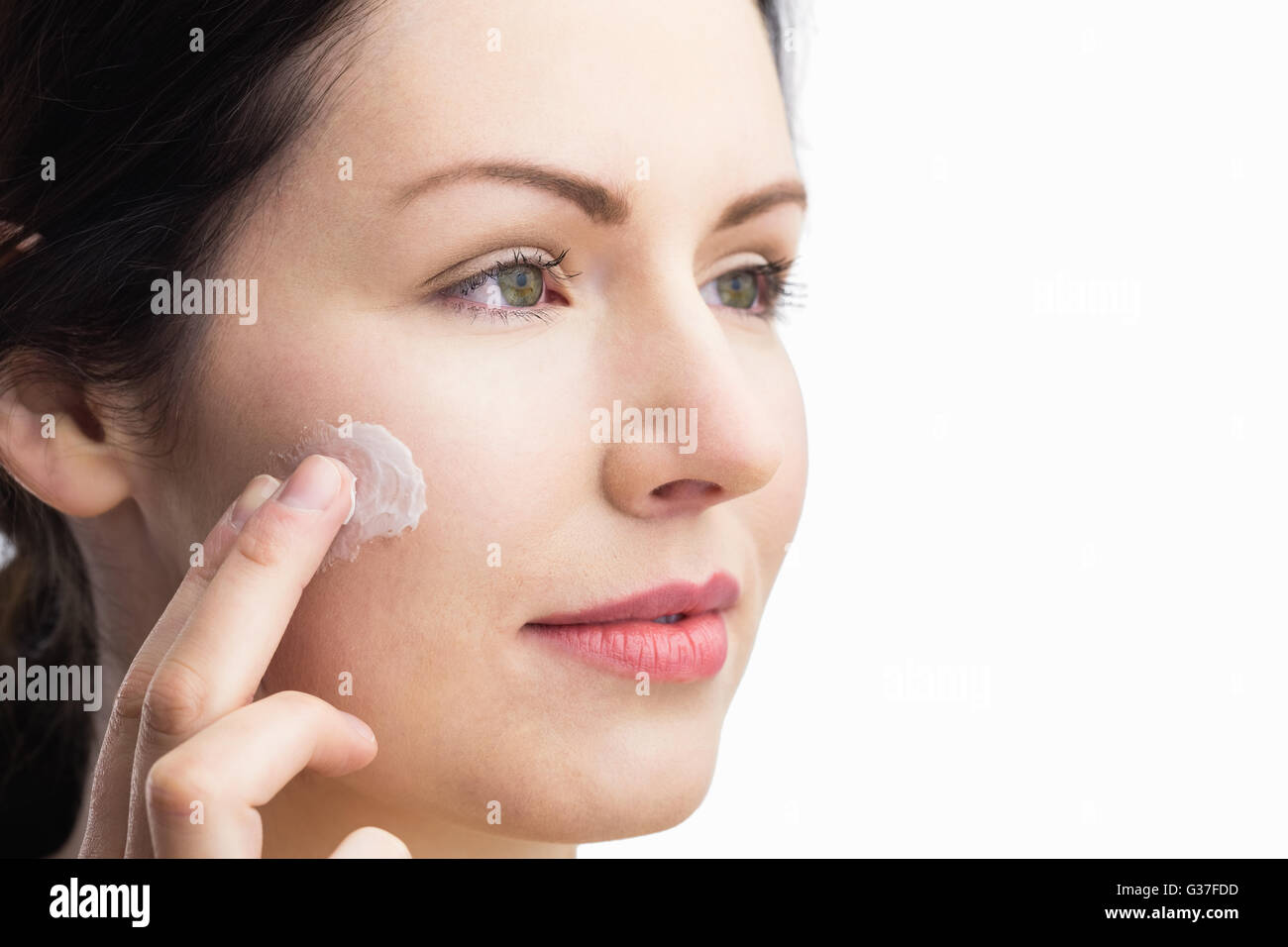 Woman applying a cream Stock Photo - Alamy