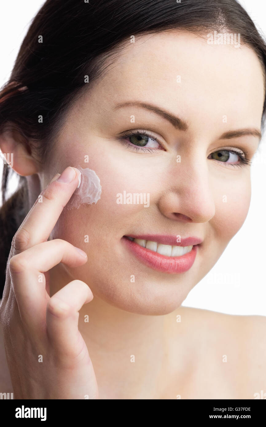 Woman applying a cream Stock Photo - Alamy