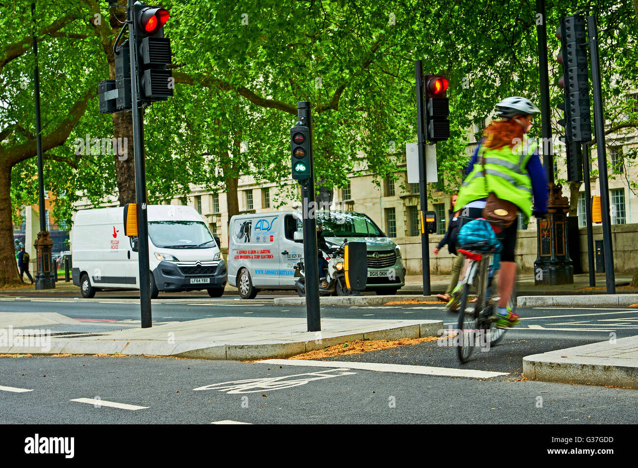 Commuters cycling to work on an urban street Stock Photo - Alamy