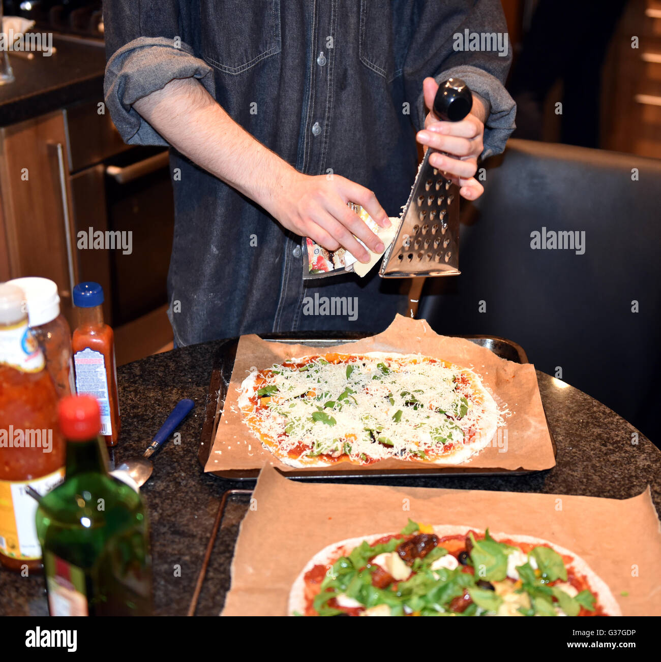 Grating cheese pizza hi-res stock photography and images - Alamy