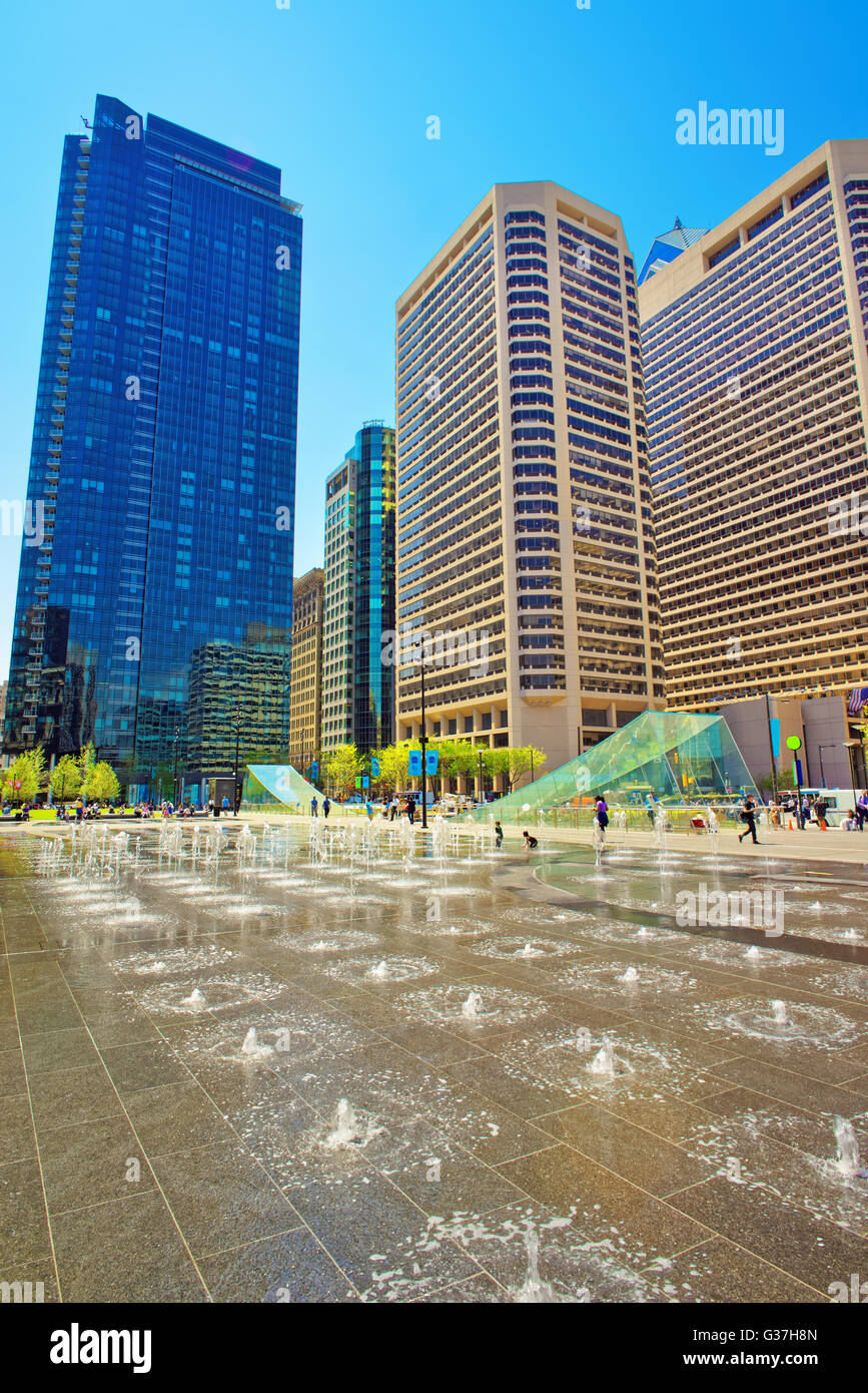 Penn Square with street fountains and skyline with skyscrapers ...