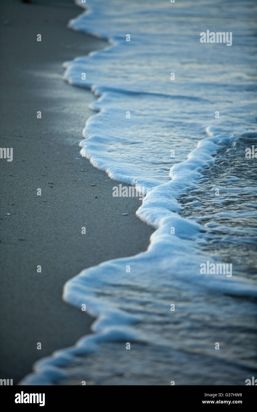 Closeup of ocean, waves, beach at sunset or dusk in Hawaii Stock Photo ...