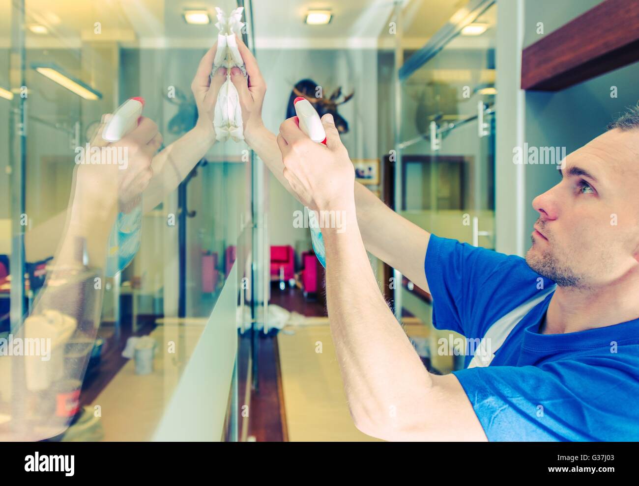 Glassy Office Interior Cleaning. Caucasian Men Cleaning Glass Elements ...