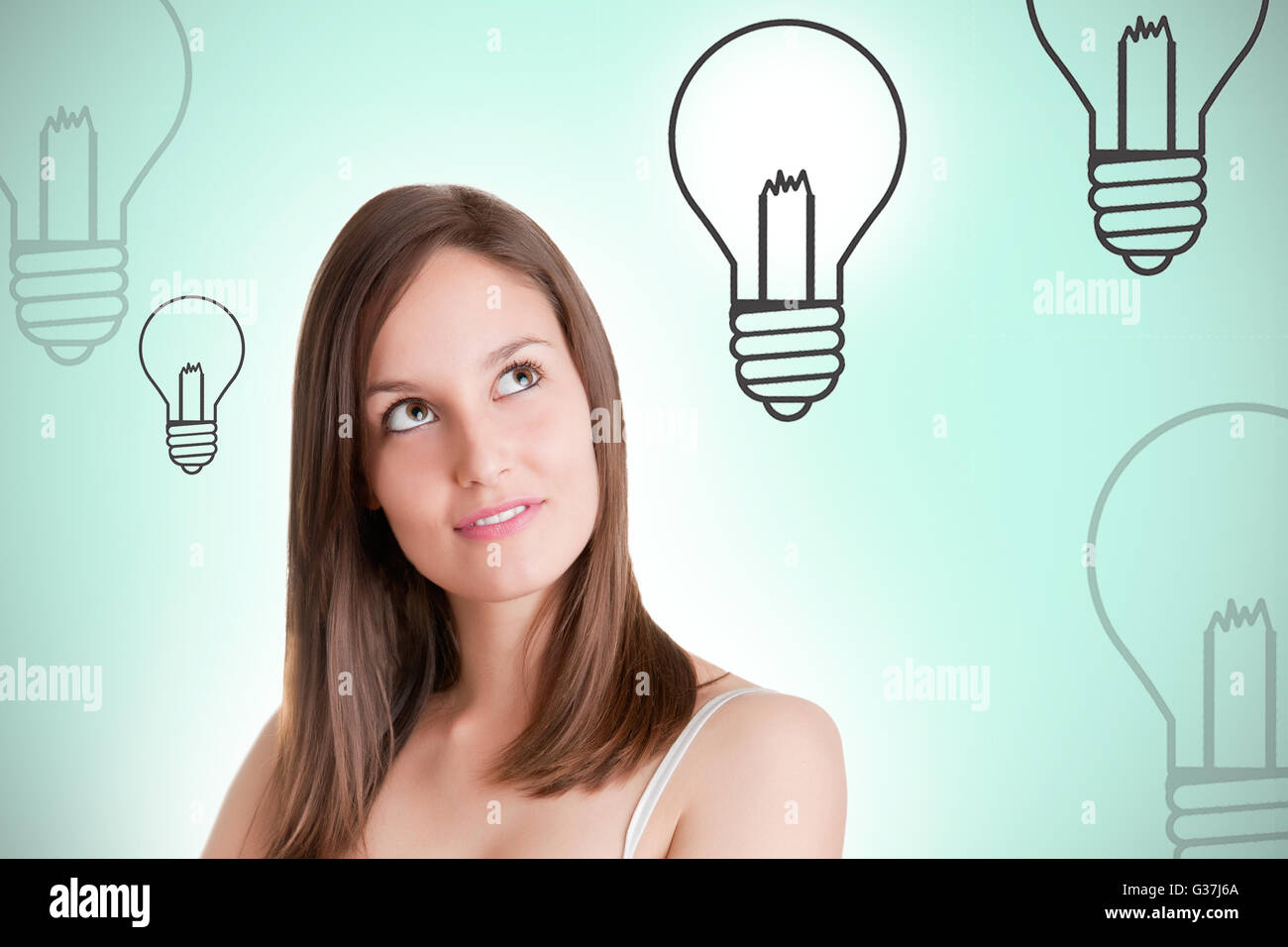 Woman thinking and having a bright idea in a green background Stock ...