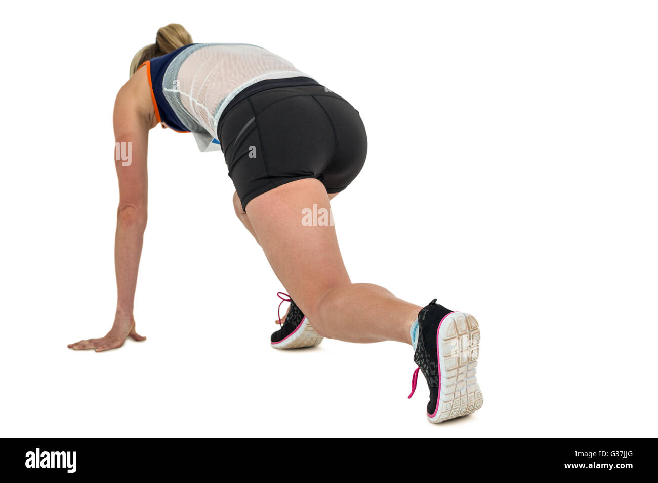 Female athlete in position ready to run Stock Photo - Alamy