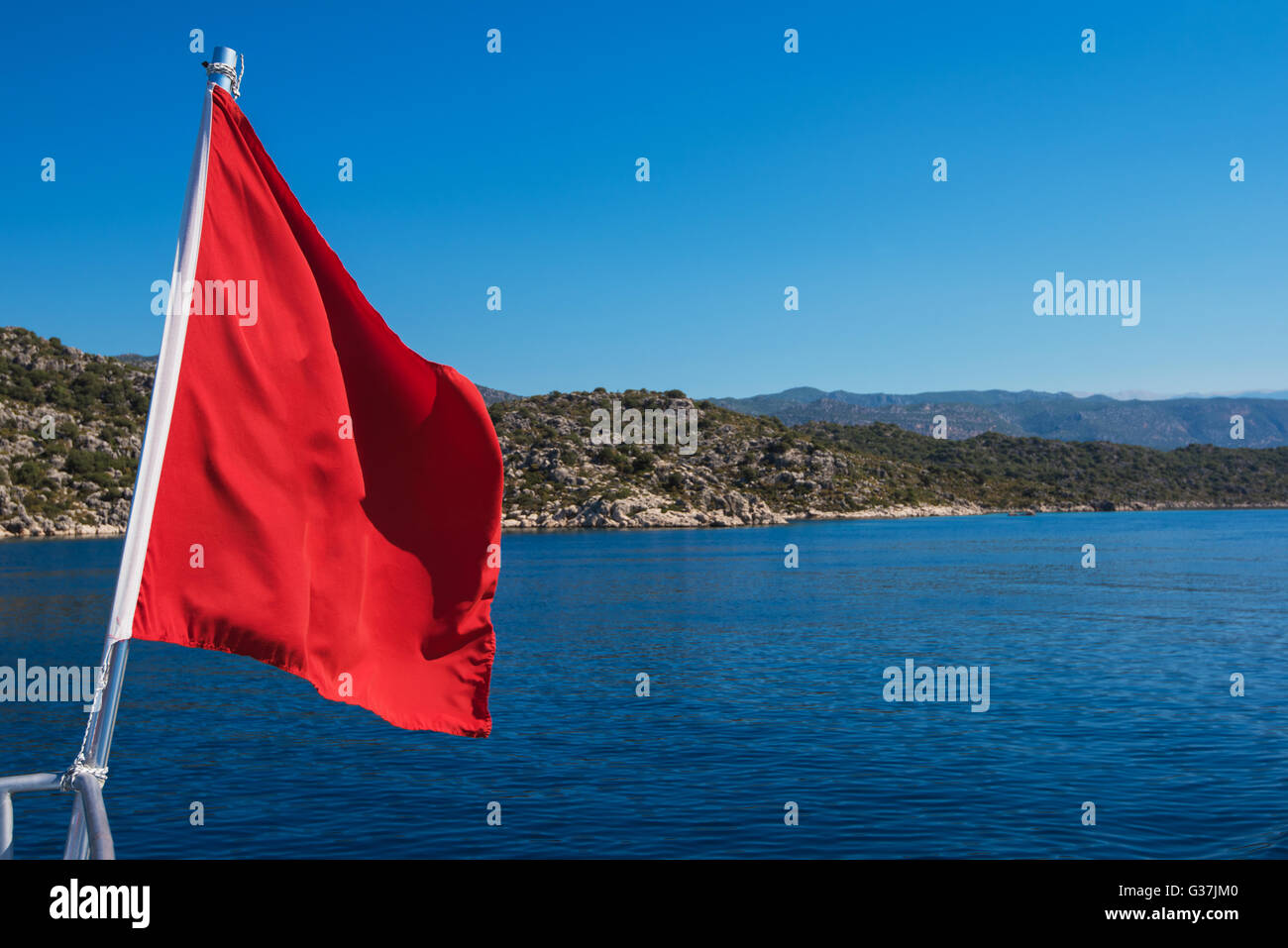 Red flag from yacht Stock Photo - Alamy