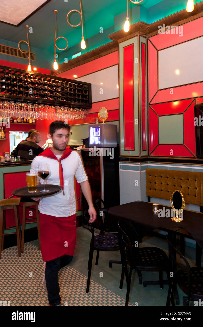 The retro red-themed decor and uniforms of waiters at Loop Bar in ...