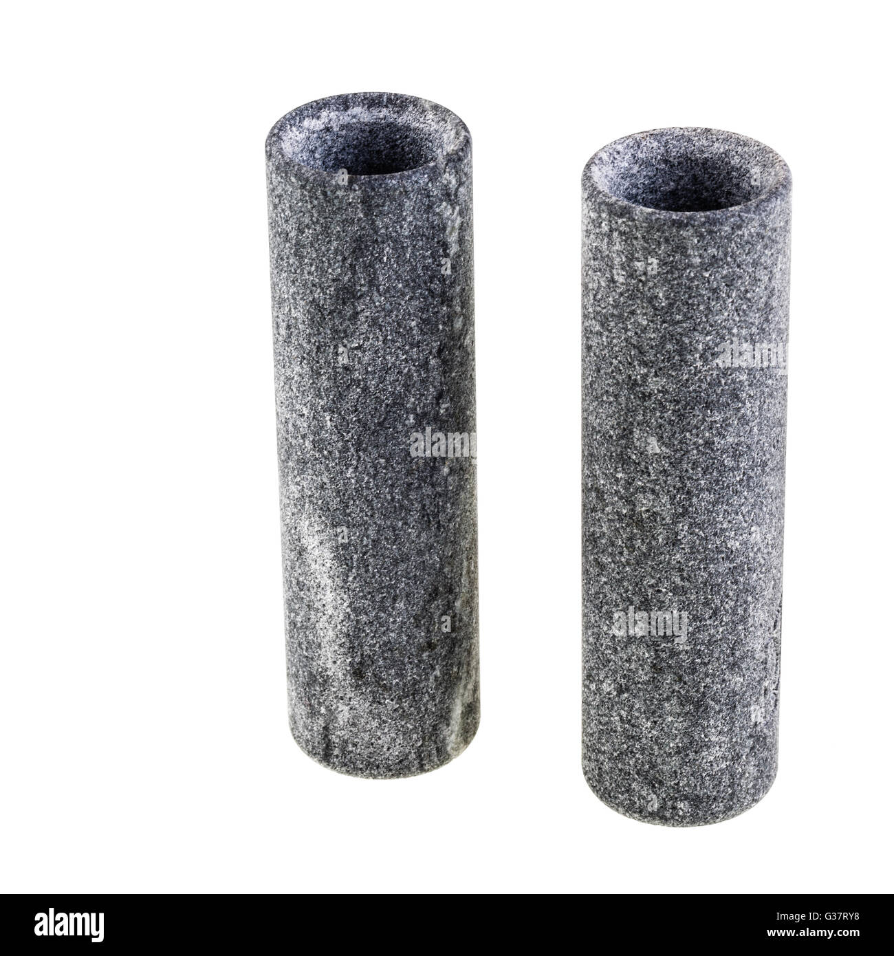 two stone shot glasses isolated over a white background Stock Photo - Alamy