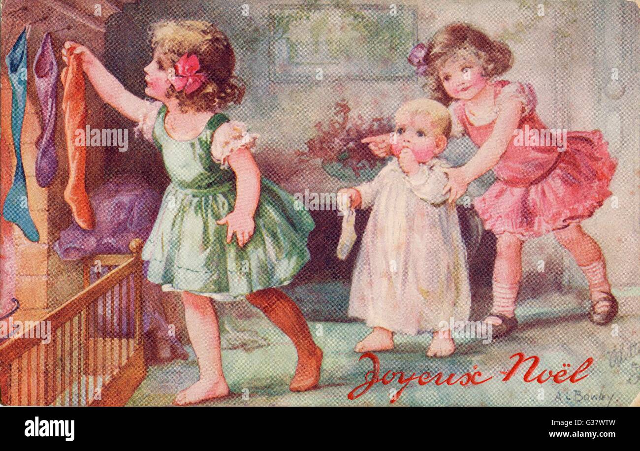 Children hanging up christmas stockings hi-res stock photography and ...