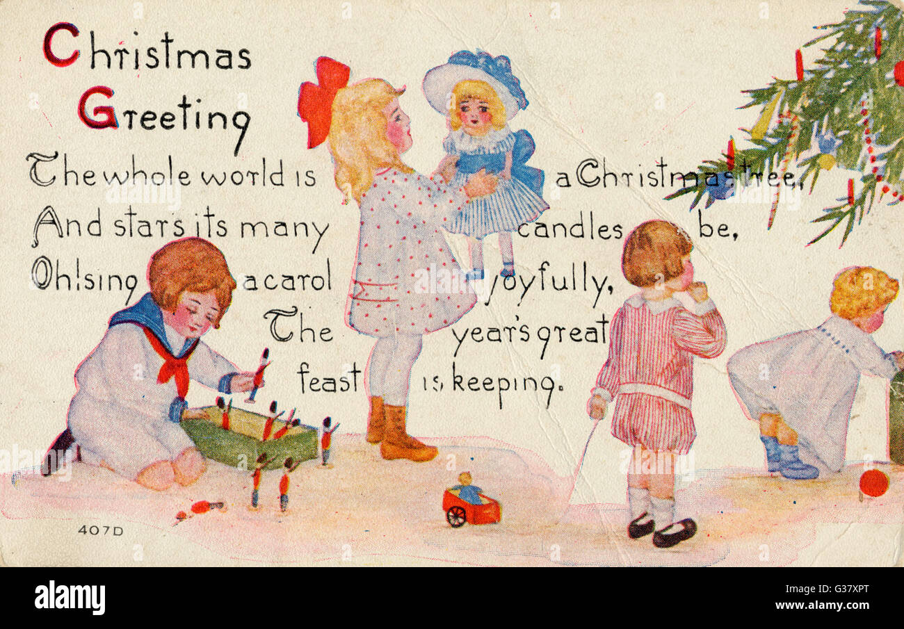Children playing with their Christmas presents, c. 1910 Stock Photo - Alamy