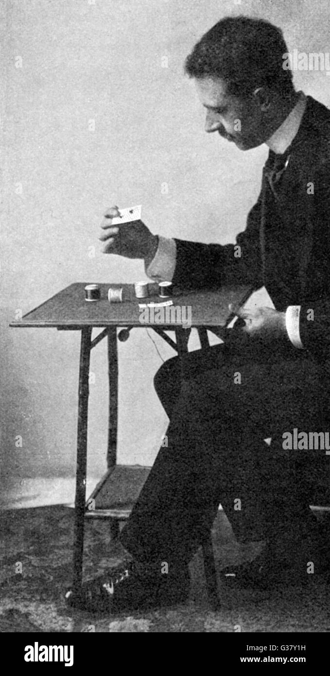 Paranormal: William S. Marriott simulates spirit 'rapping' Stock Photo ...