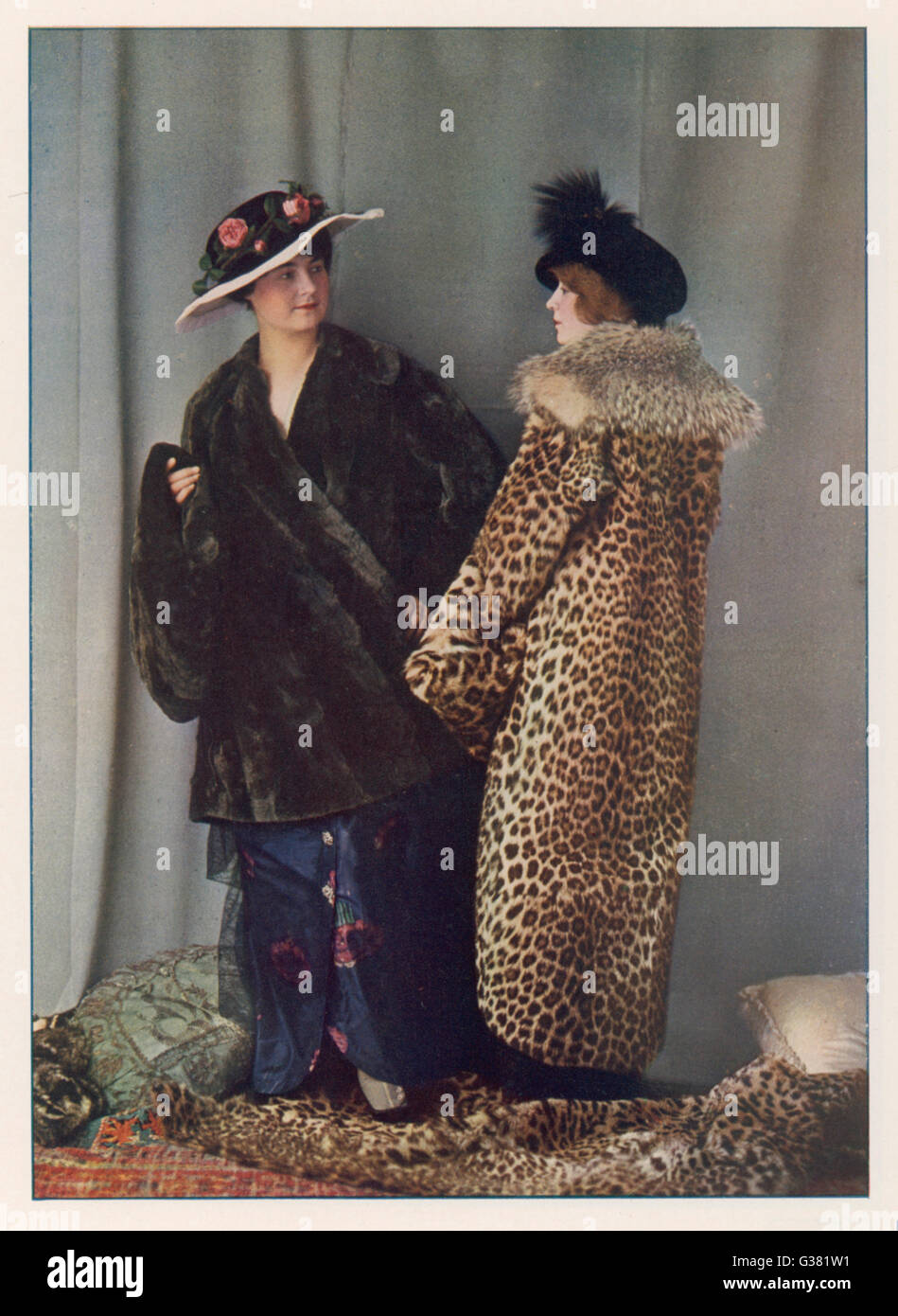 A short, wrap-over fur coat & flat muff in a dark coloured fur; full ...