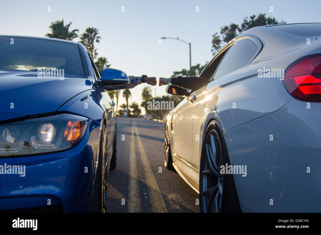 M Series BMW Fist Bump with Sunset and Palm Trees Stock Photo - Alamy