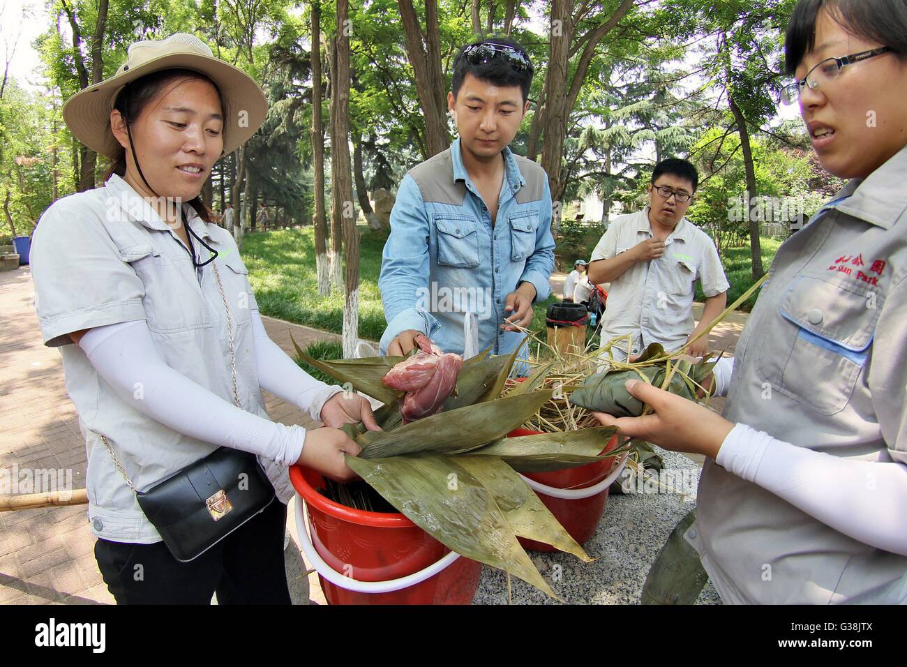 Yantai, China's Shandong Province. 9th June, 2016. Workers make meat ...