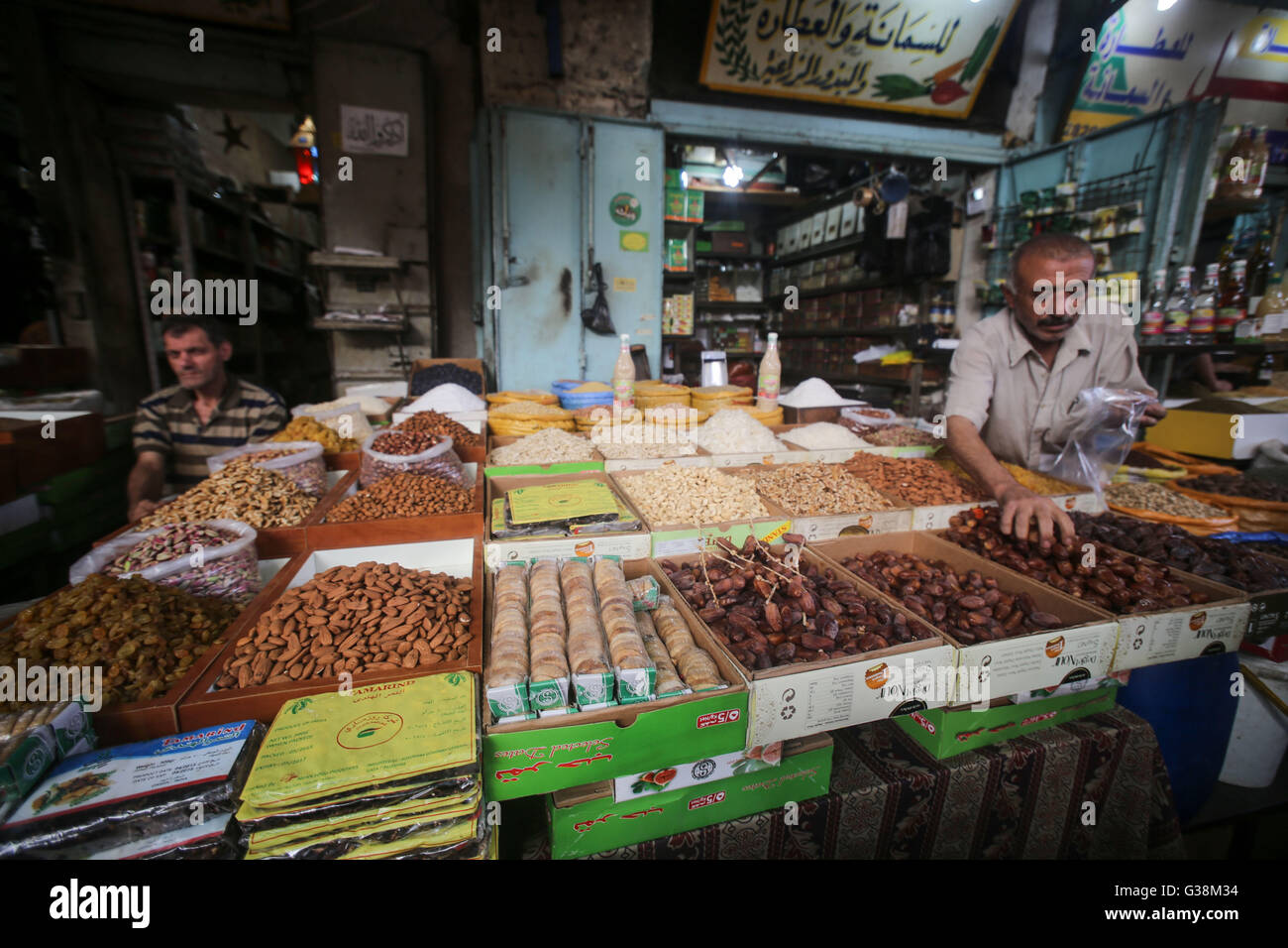 Palestinian vendors display different models of food, candy, meats ...