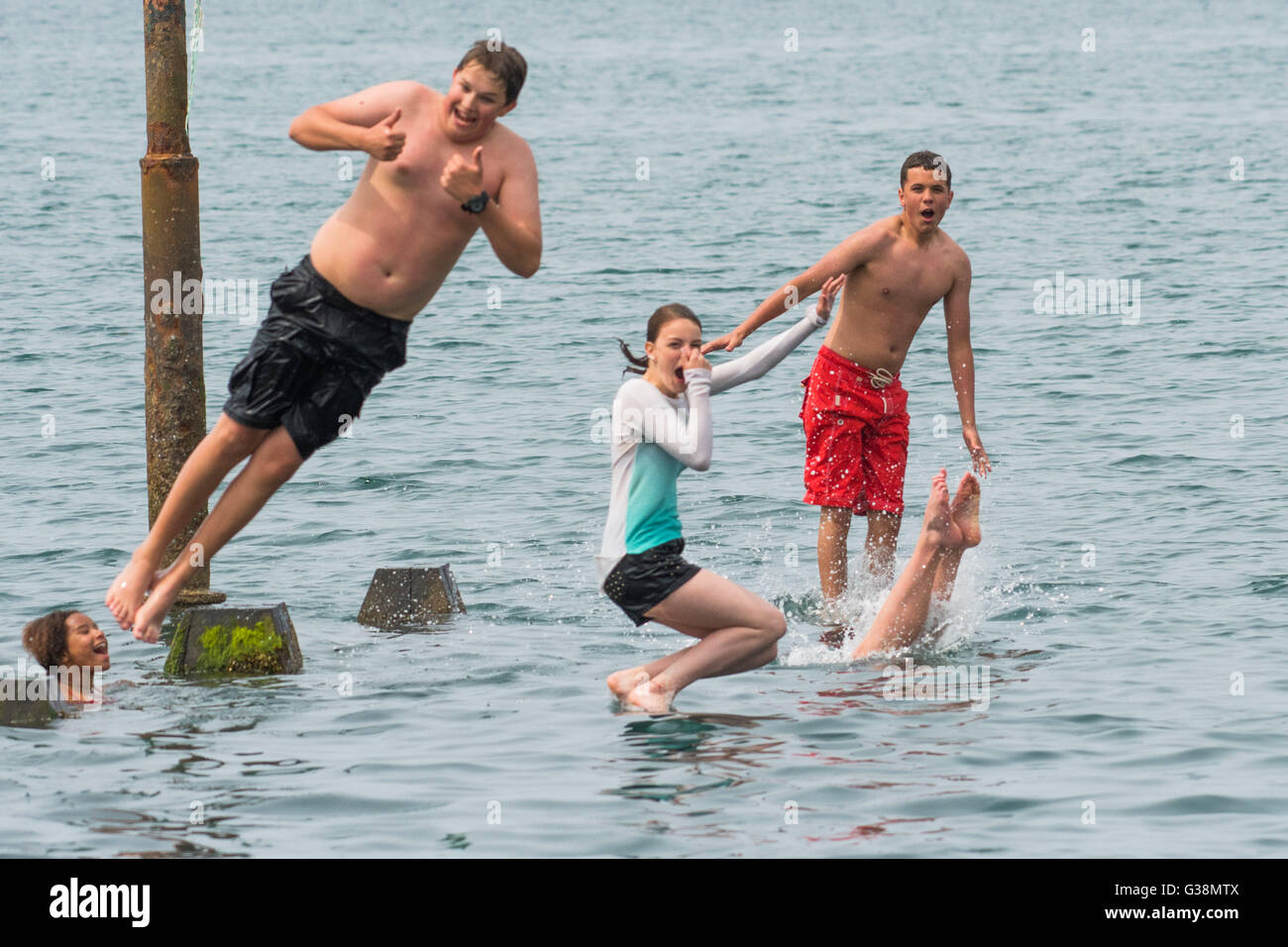 Boy jumping off pier hi-res stock photography and images - Alamy