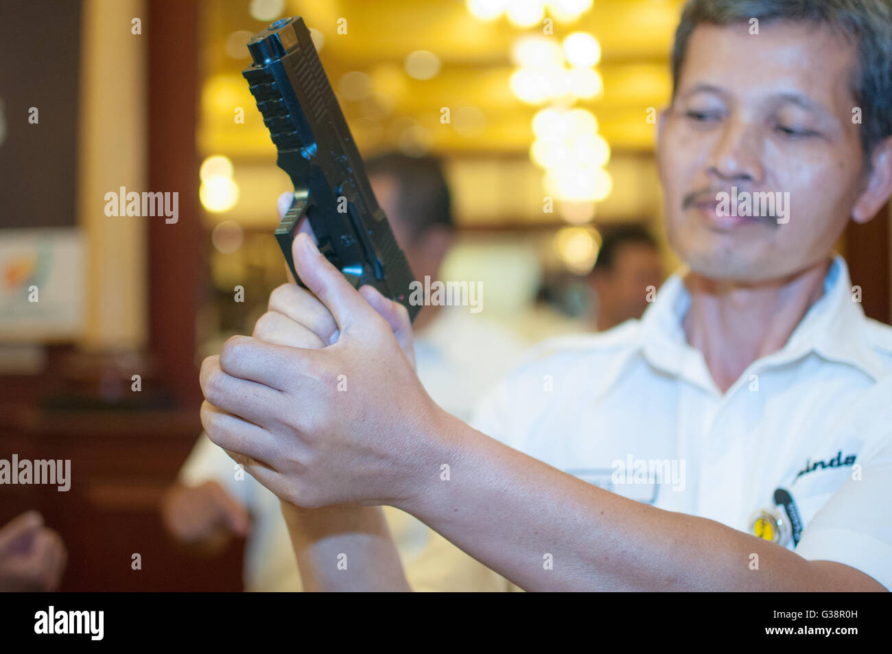 Central Jakarta, Indonesia. 09th June, 2016. Pindad staff shows Pistol ...