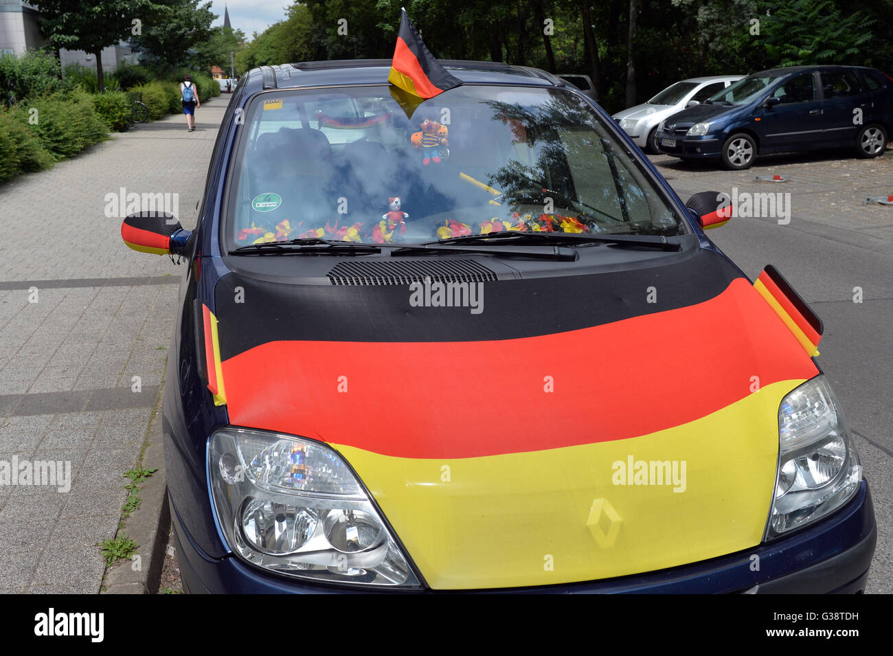 Berlin, Germany. 09th June, 2016. A car decorated with the German flag ...