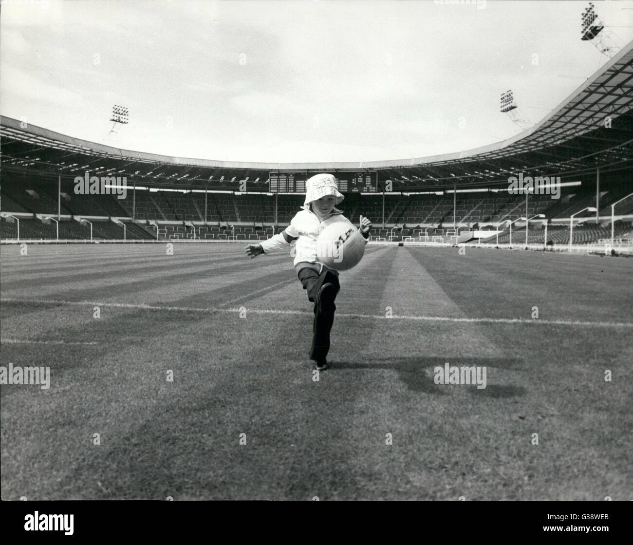 1965 - boy kick soccer ball on Champions League field stadium ...