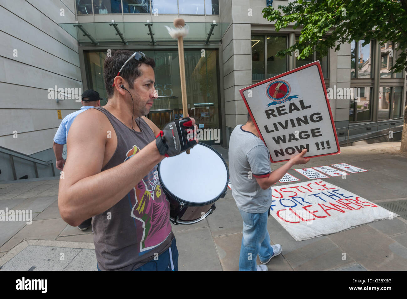 London, UK. 9th June 2016. A man bangs a drum at the protest by grass ...