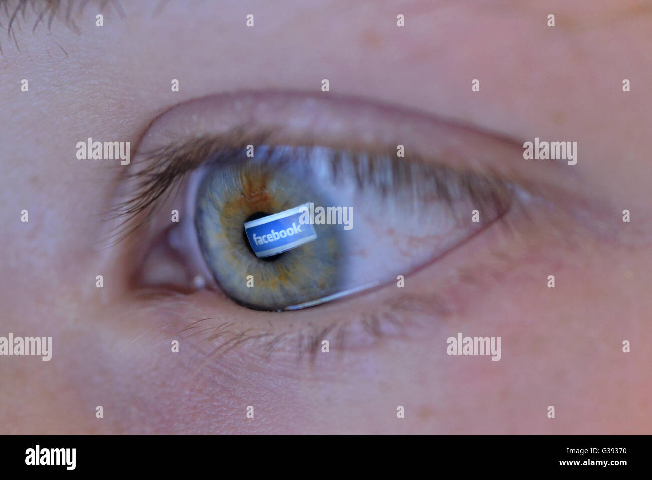 Eye showing Facebook symbol Stock Photo - Alamy
