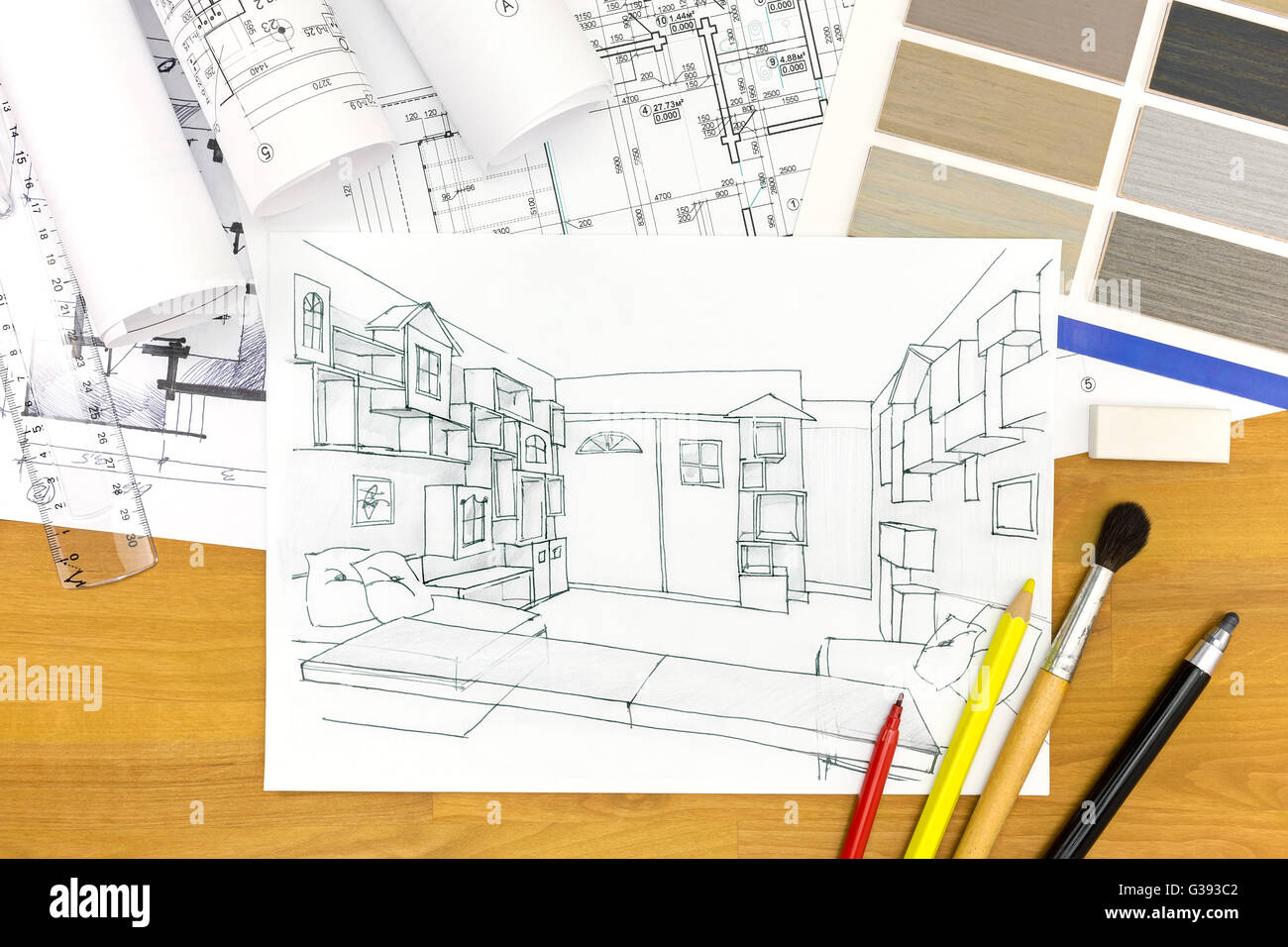 architect’s workspace with architecture hand-drawn sketch and rolls of ...