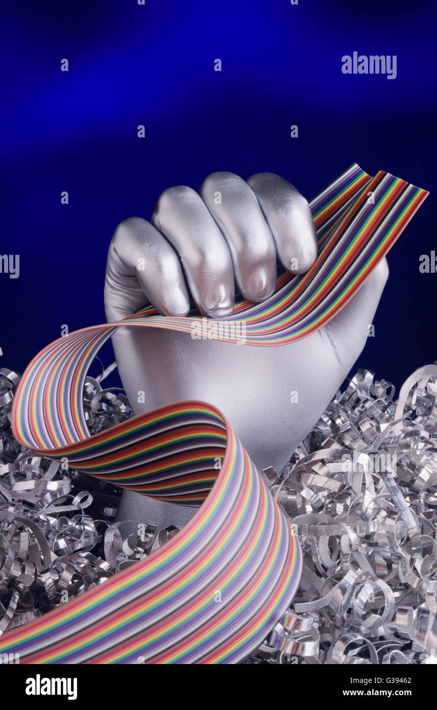 Silver Hand holding Computer rainbow cable Stock Photo - Alamy