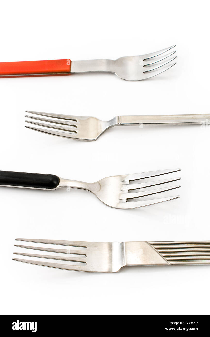Four silver forks isolated over white background Stock Photo - Alamy