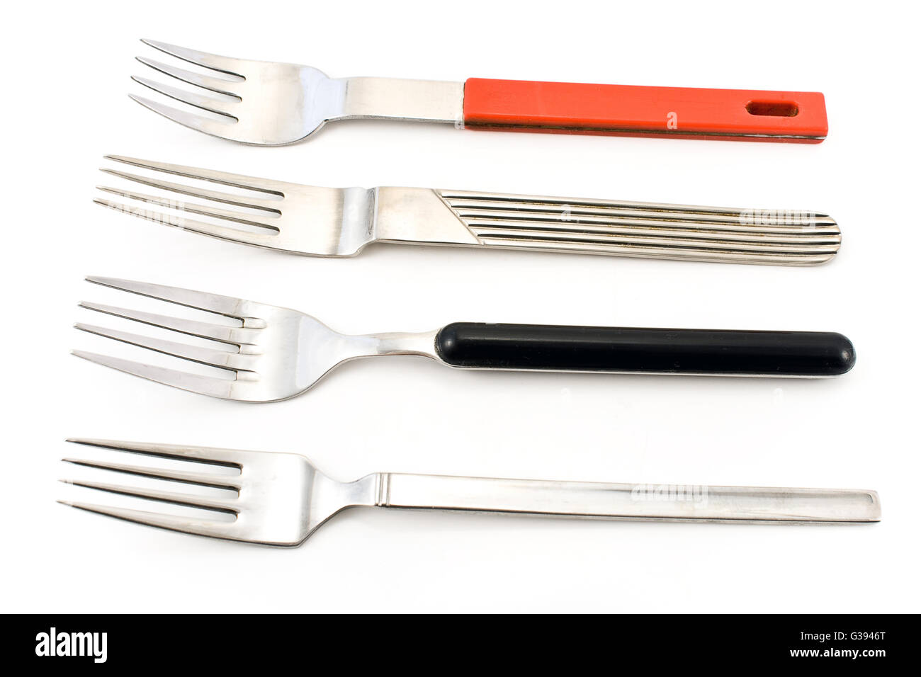 Four silver forks isolated over white background Stock Photo - Alamy