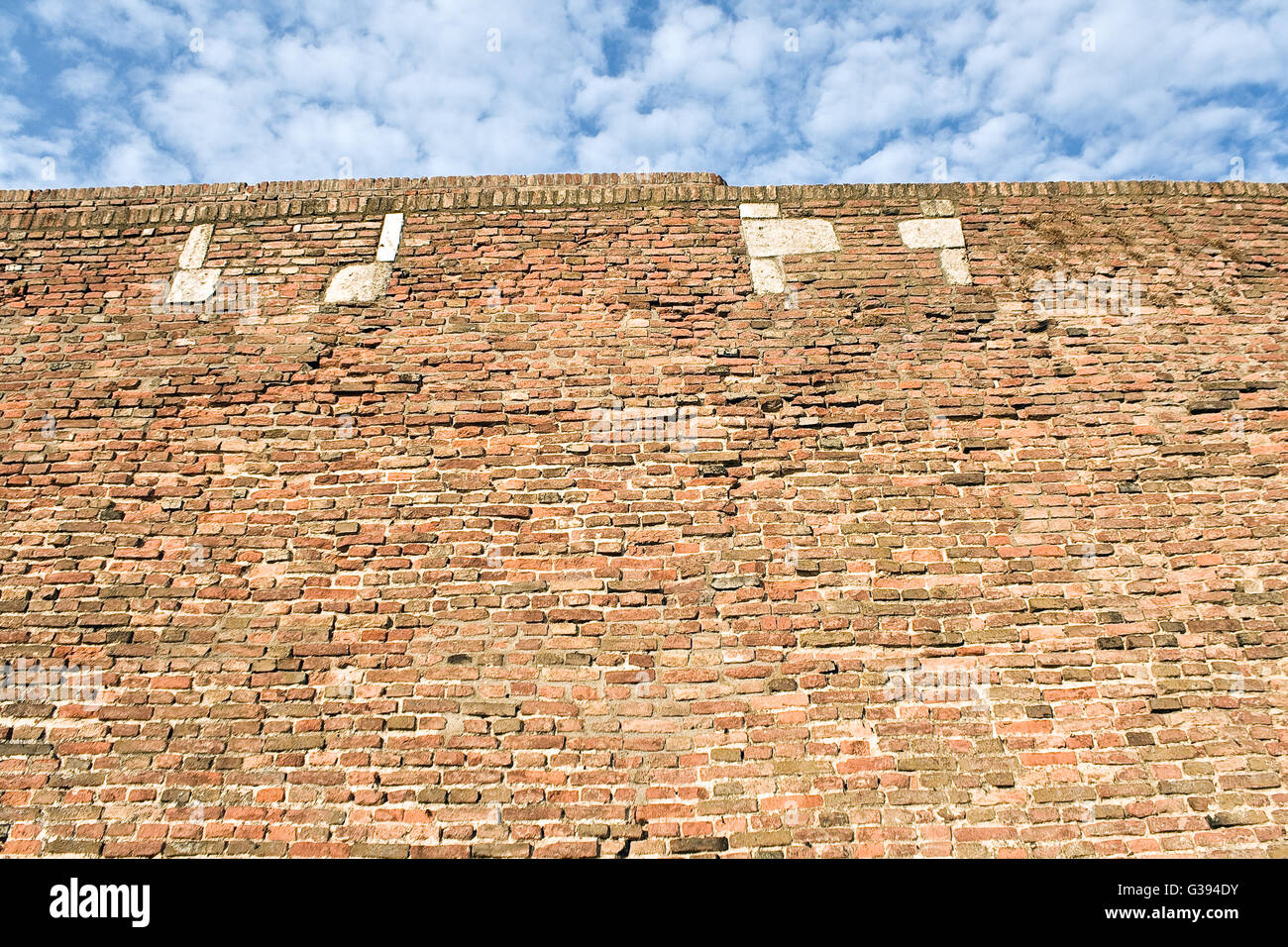 Fortress brick wall and sky as background Stock Photo - Alamy