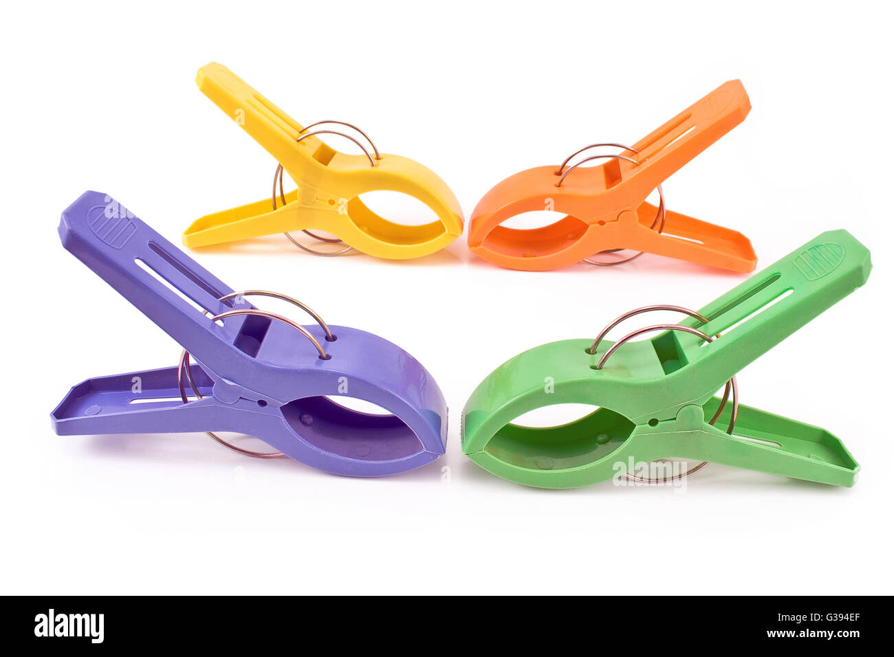 Colorful large cloth pins isolated on white Stock Photo - Alamy