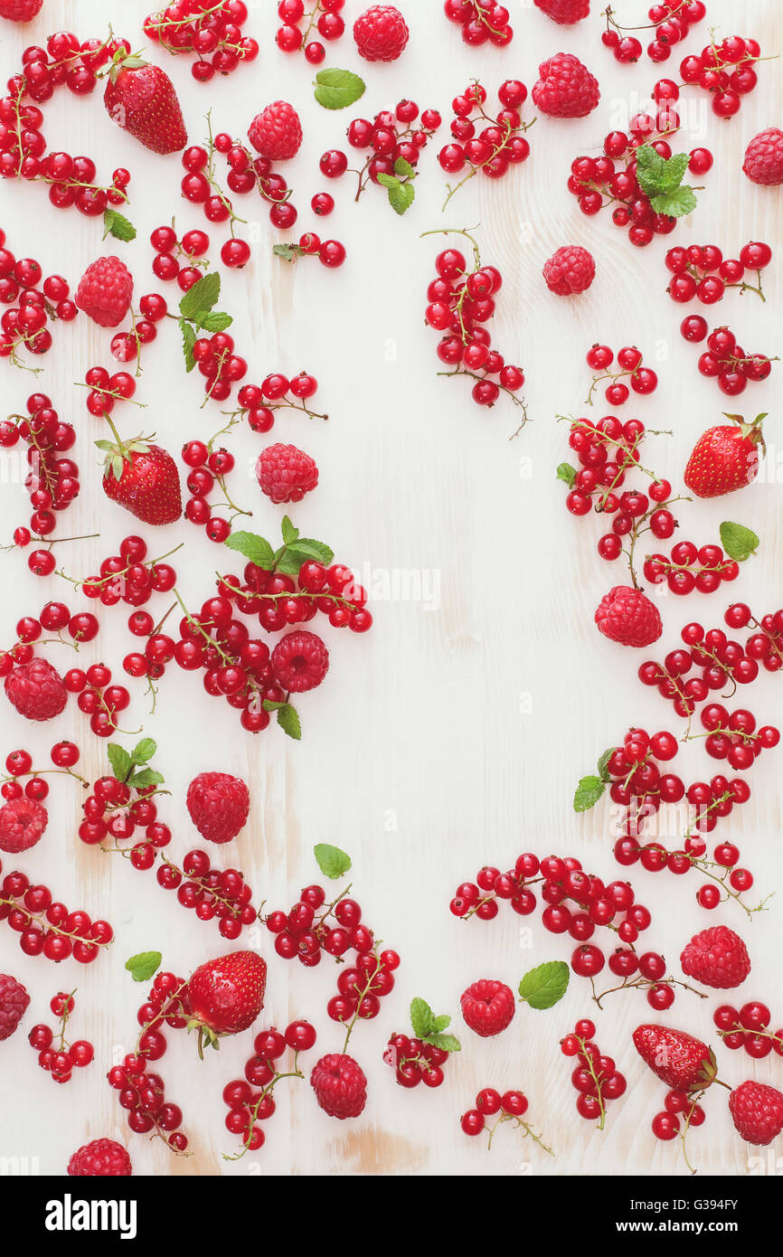 Fresh berry fruits. Fresh organic berry fruit scattered on rustic table ...