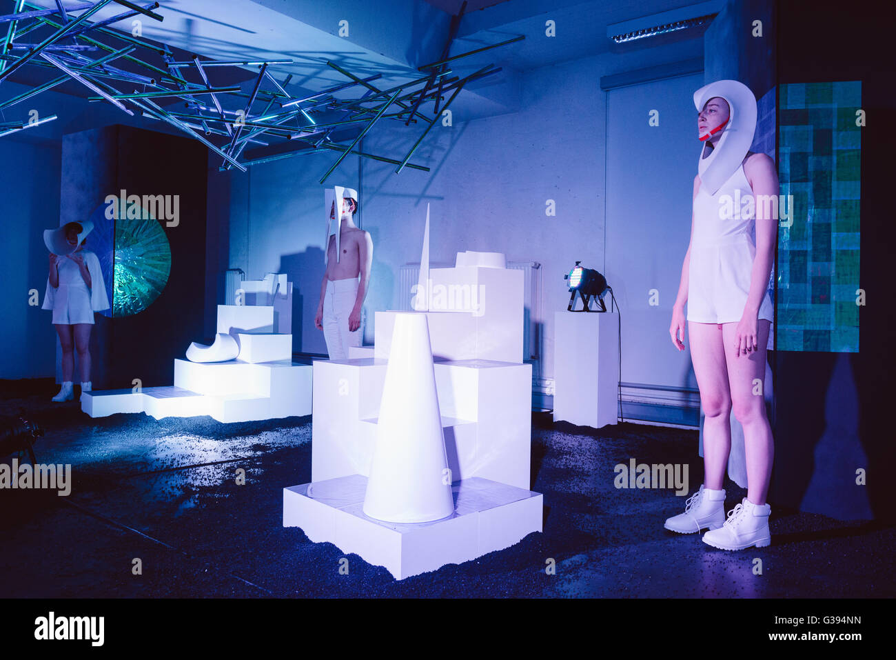 Models with spacey porcelain hat in blue show room Stock Photo - Alamy