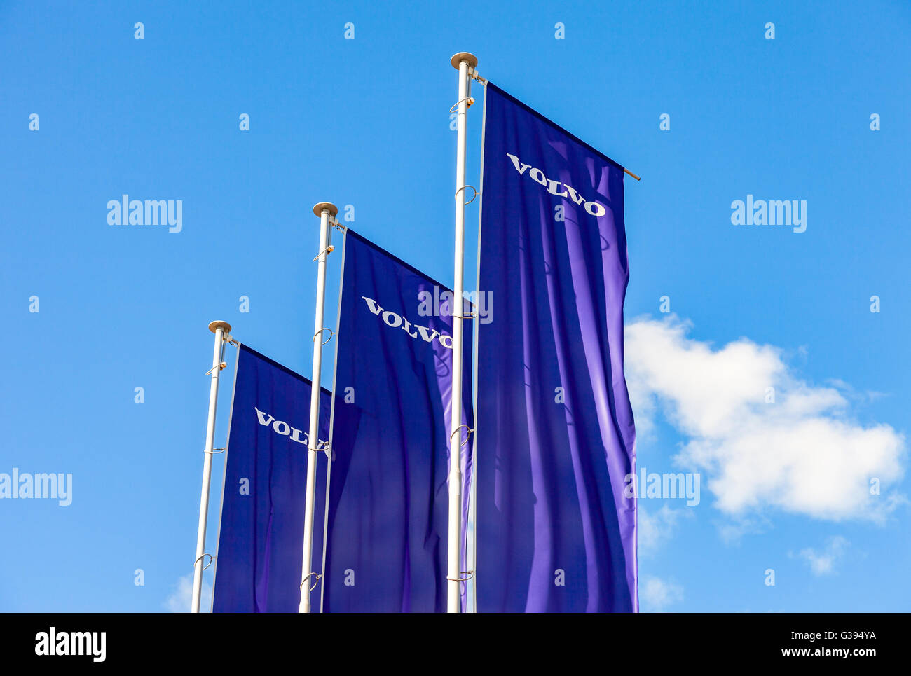 Volvo dealership flags over blue sky. Volvo is a Swedish multinational ...