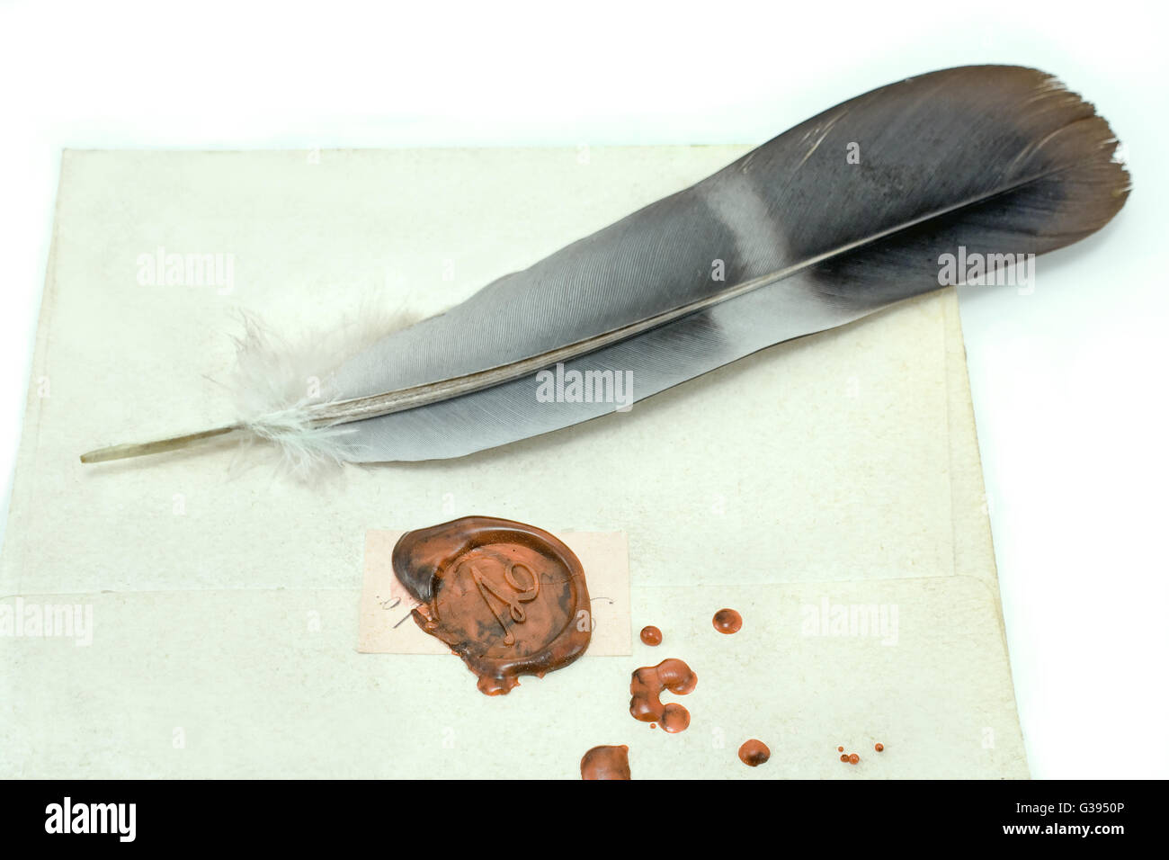 Wax sealed letter with quill on white Stock Photo - Alamy