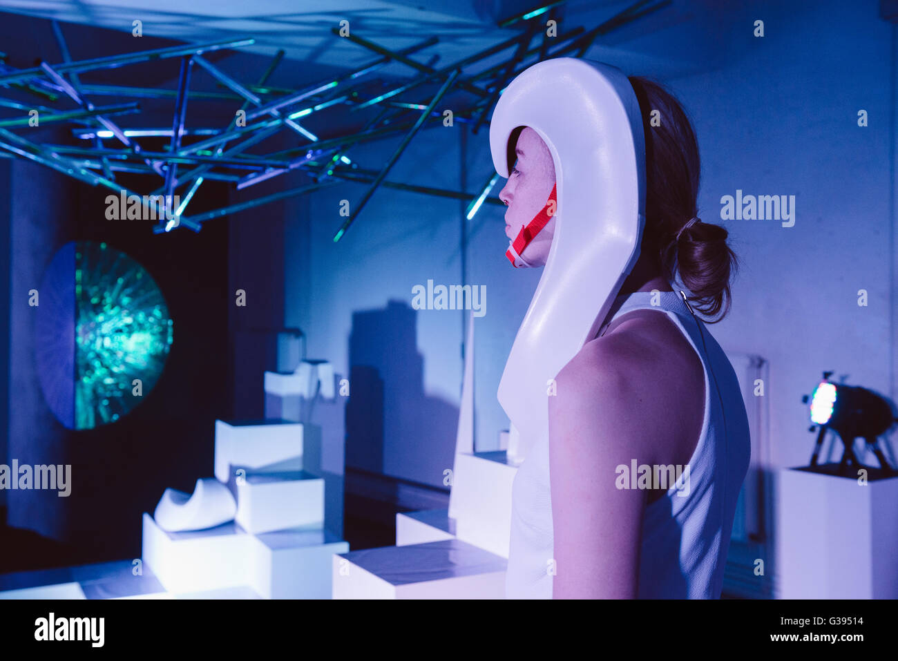 Intergalactic future female fashion model in blue show room Stock Photo ...