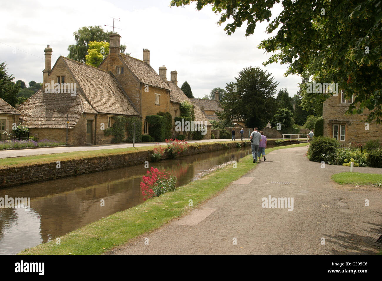 Cotswolds. The River Eve meanders through the village of Lower ...