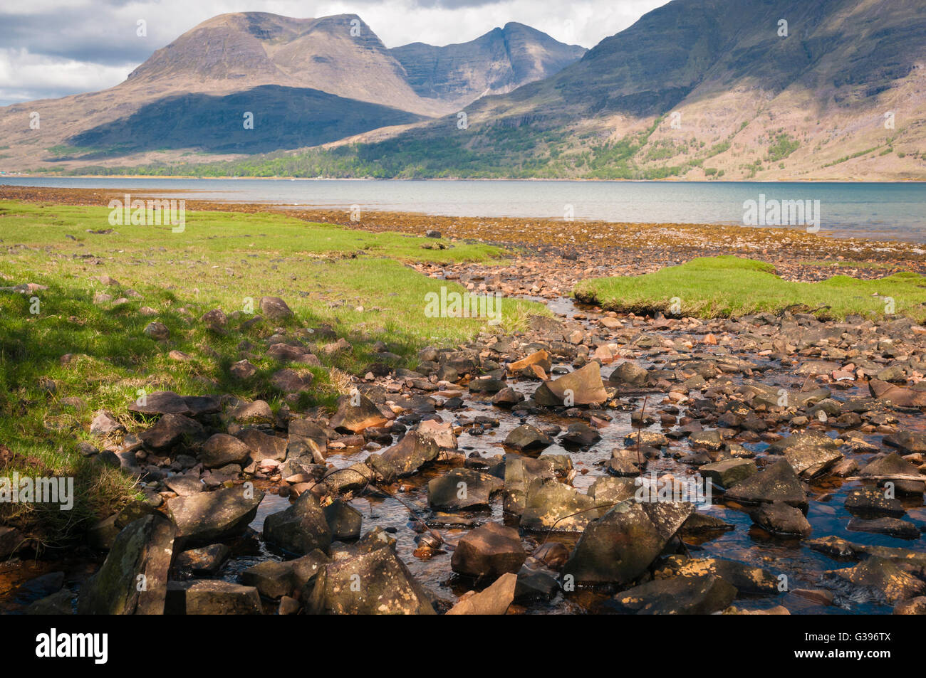 Beinn Alligin, a mountain and munro, viewed from across Upper Loch ...
