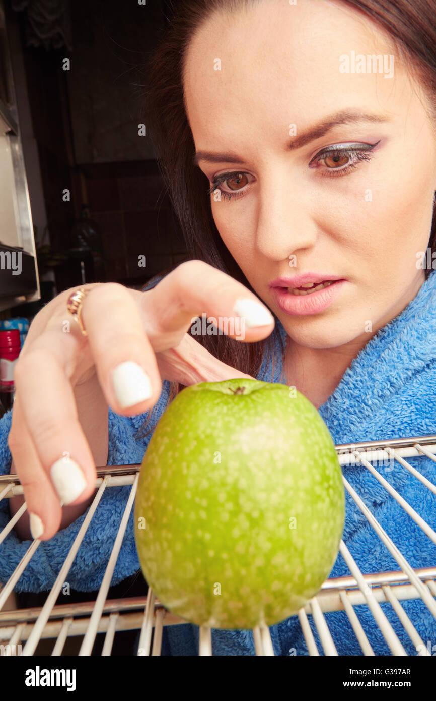 girl taking apple from refrigerator Stock Photo - Alamy