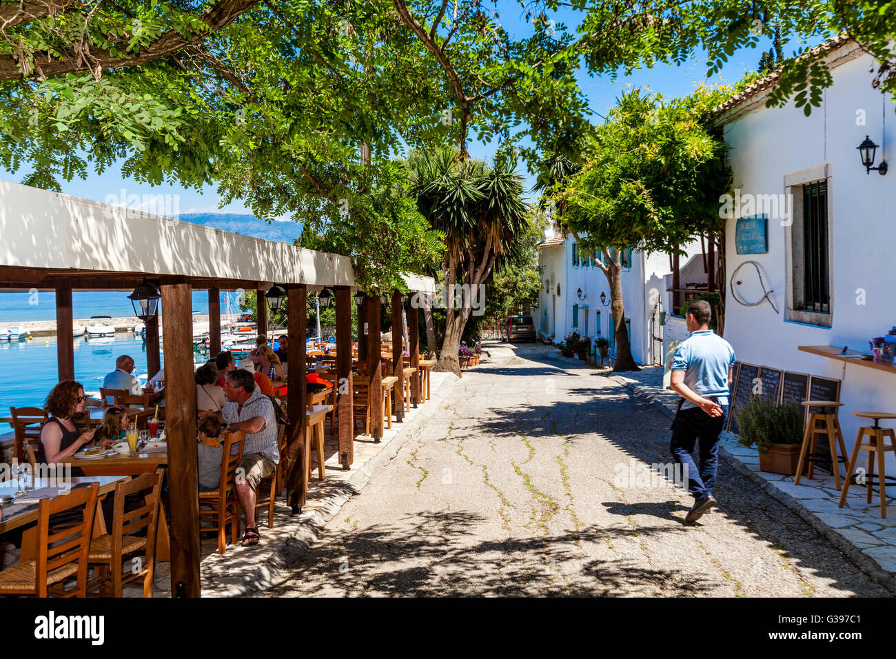 A Taverna In The Fishing Village Of Kouloura, Corfu Island, Greece ...