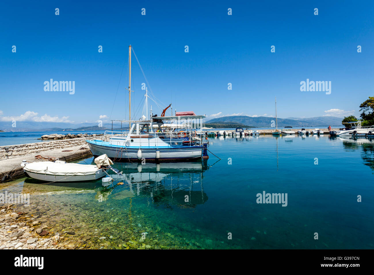 The Harbour At The Fishing Village Of Kouloura, Corfu, Greece Stock ...