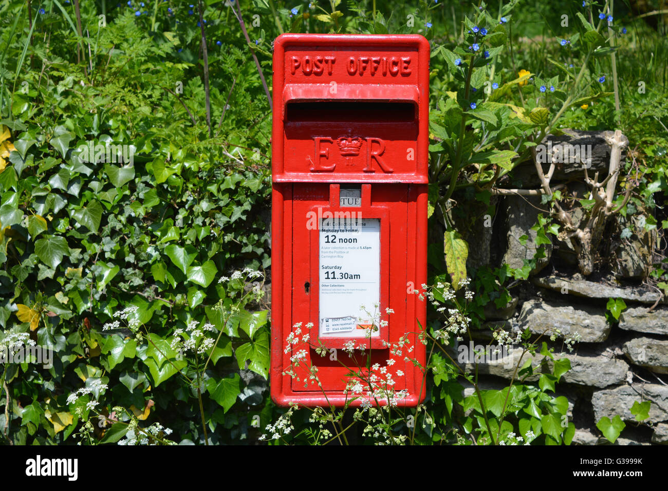 ER red post box, set into the wall in the rural village of Shepton ...